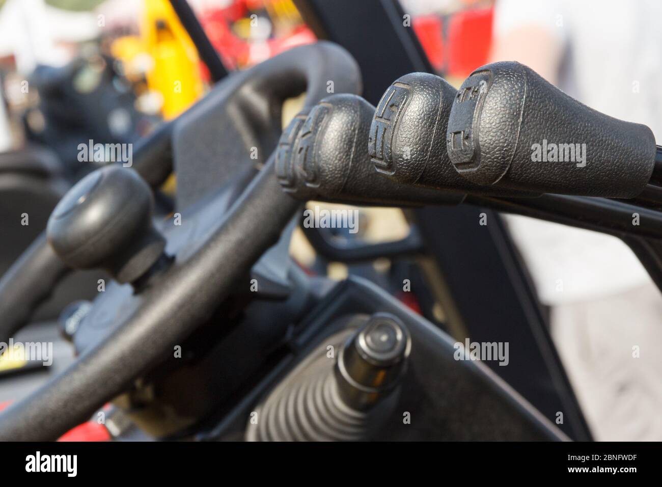 Operating control panels or levers and steering wheel in forklift or ...