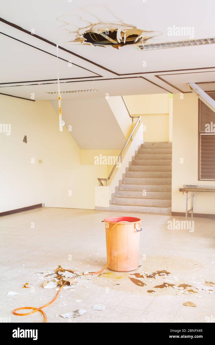 water leak drop in red tank interior office building in from ceiling ...