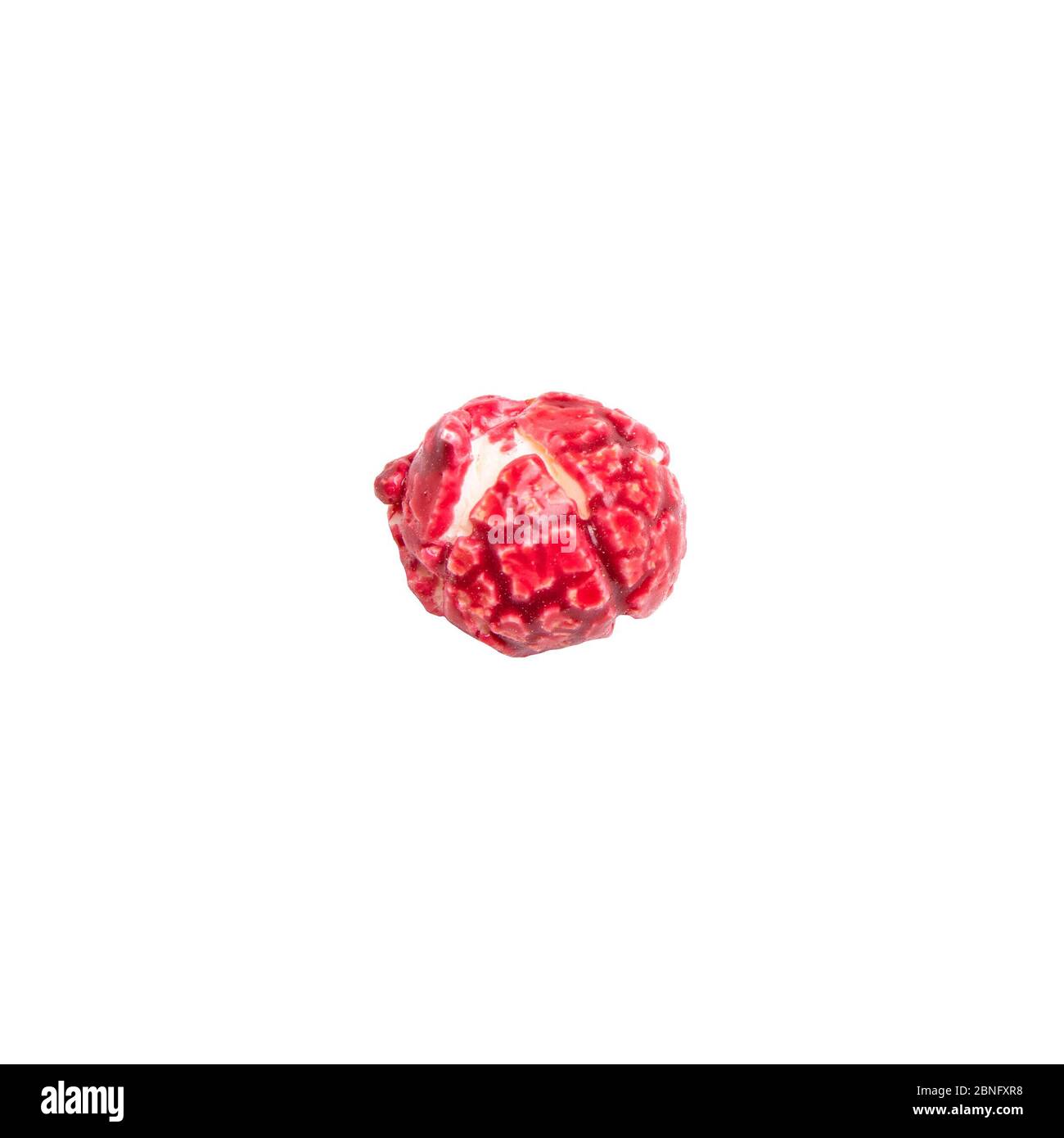 red popcorn close-up on white background Stock Photo - Alamy
