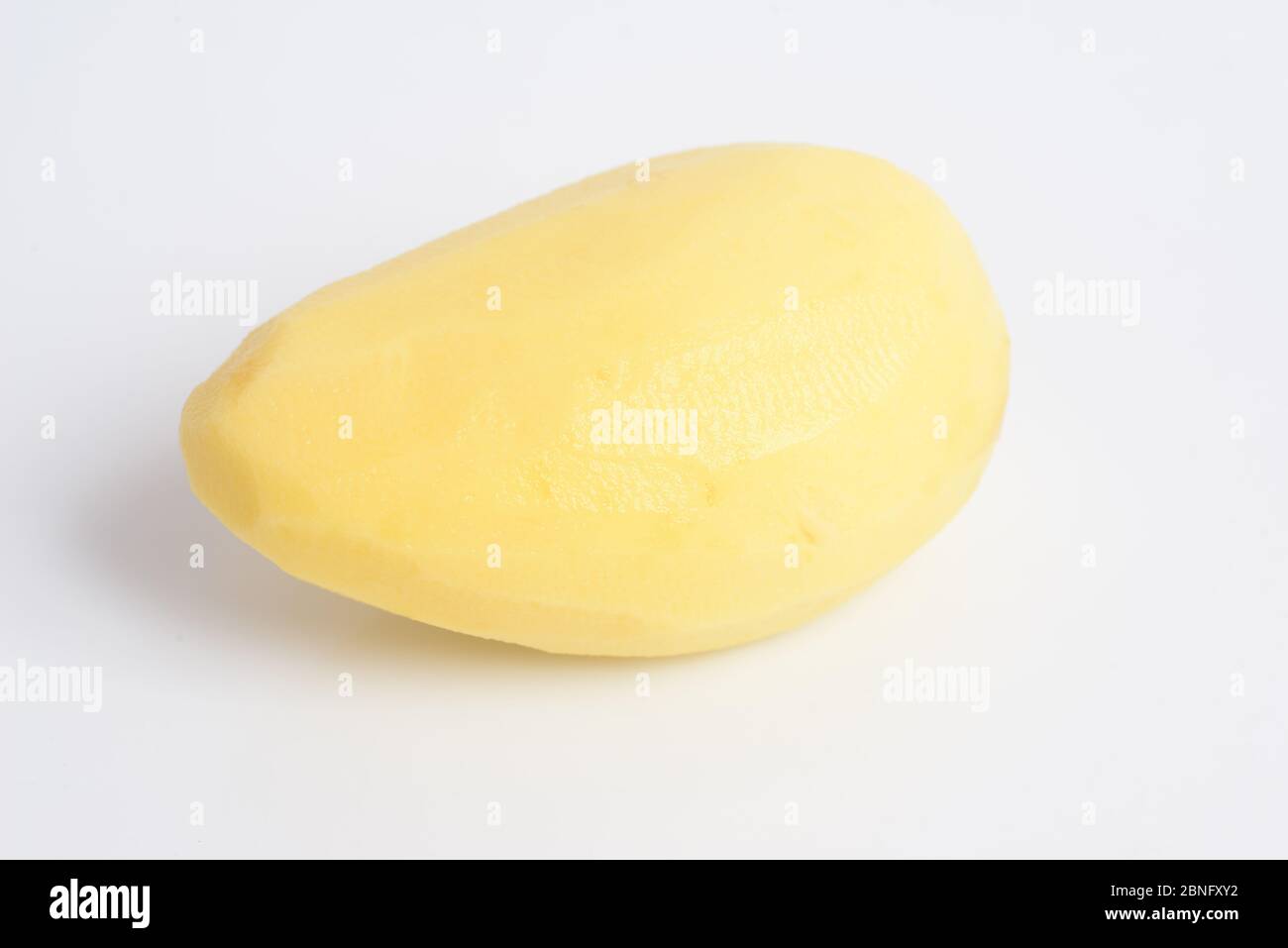 Raw peeled potato on white background Stock Photo - Alamy