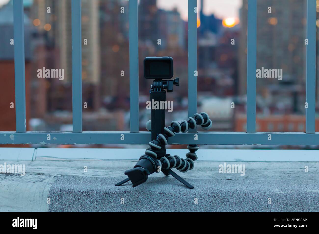 Camera set up with an action cam and a tripod on a rooftop in Manhattan ...
