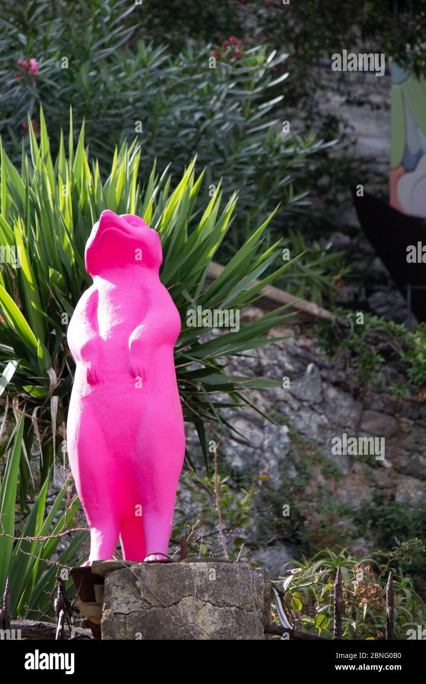 Pink animal statue in the park of Portofino harbor in Italy Stock Photo ...