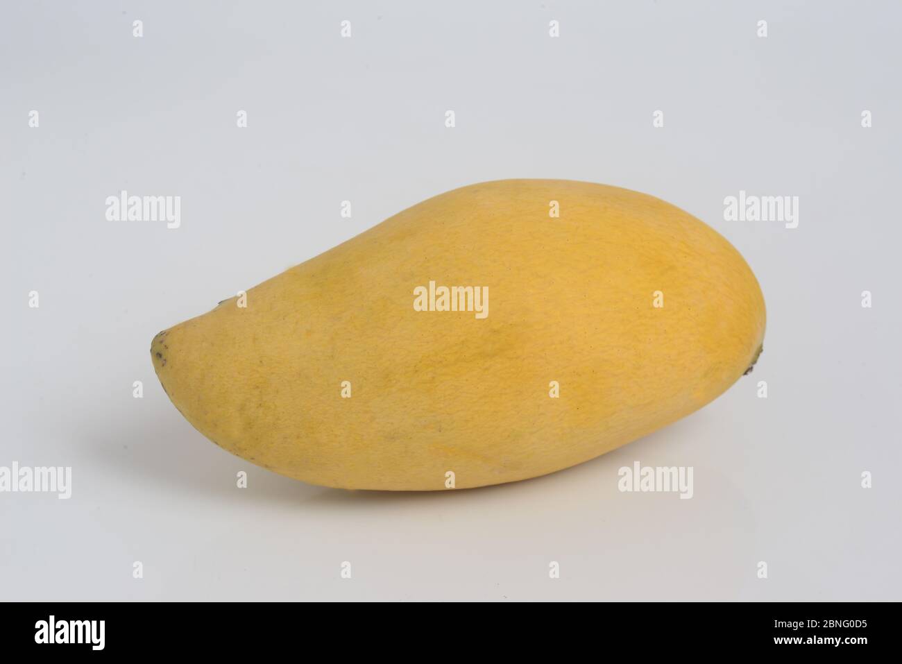 yellow mango on white background Stock Photo - Alamy