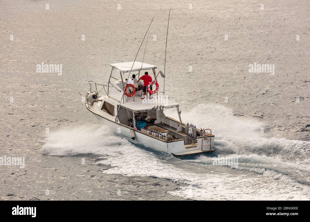 Fishing boat moving very fast with water splashing around it Stock ...