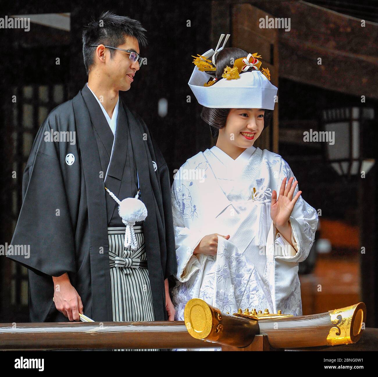 Bride and groom taking wedding photos at the Meiji Shrine in Tokyo ...