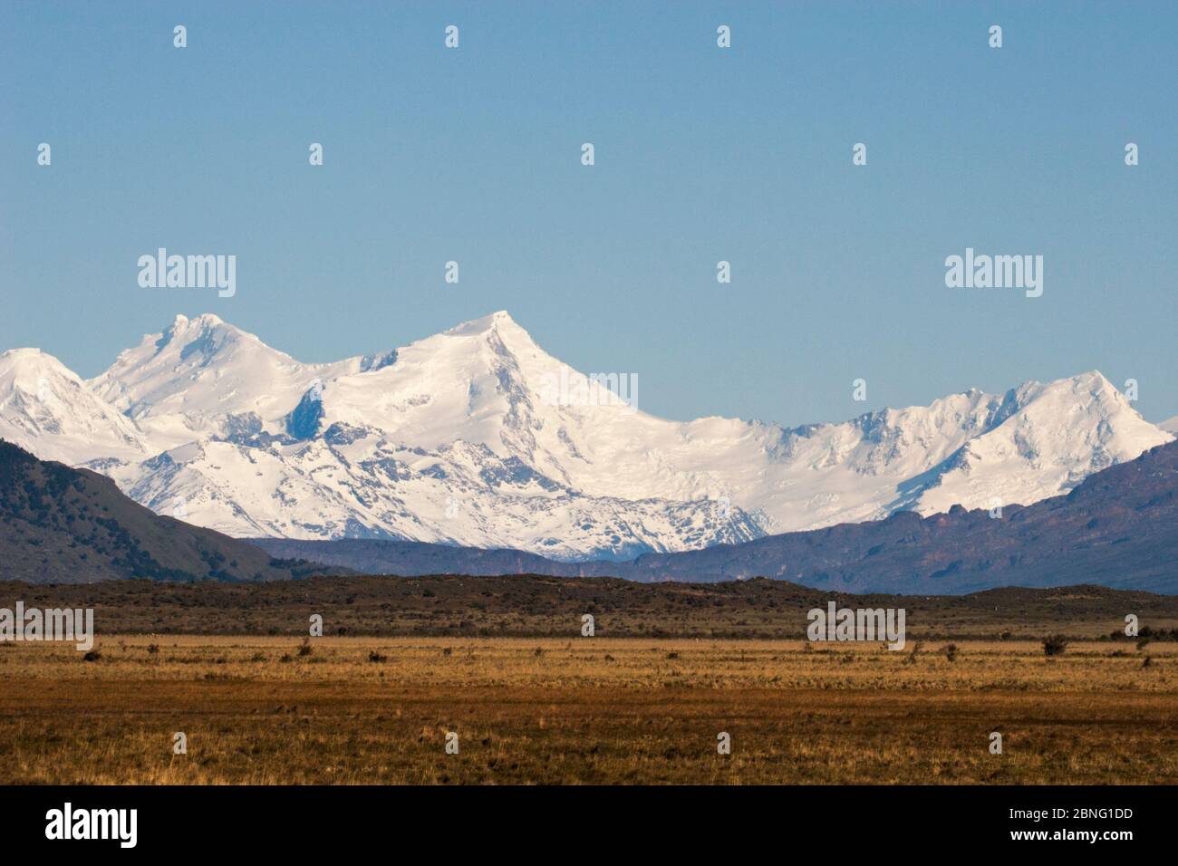 Snow covered Andes Mountains and Patagonian steppe landscape with clear ...