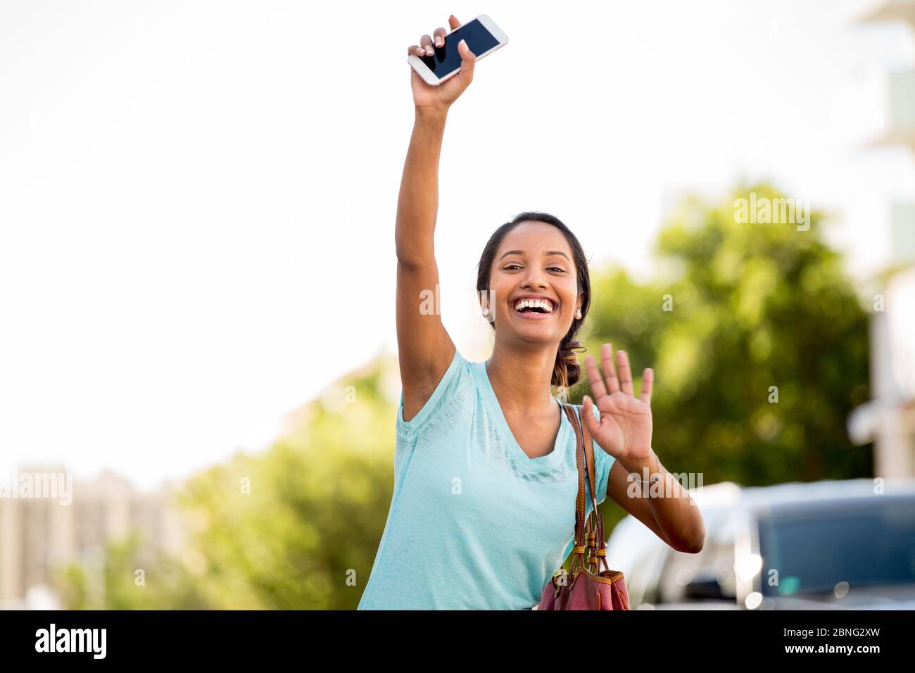 Beautiful woman smiling waving hi-res stock photography and images - Alamy