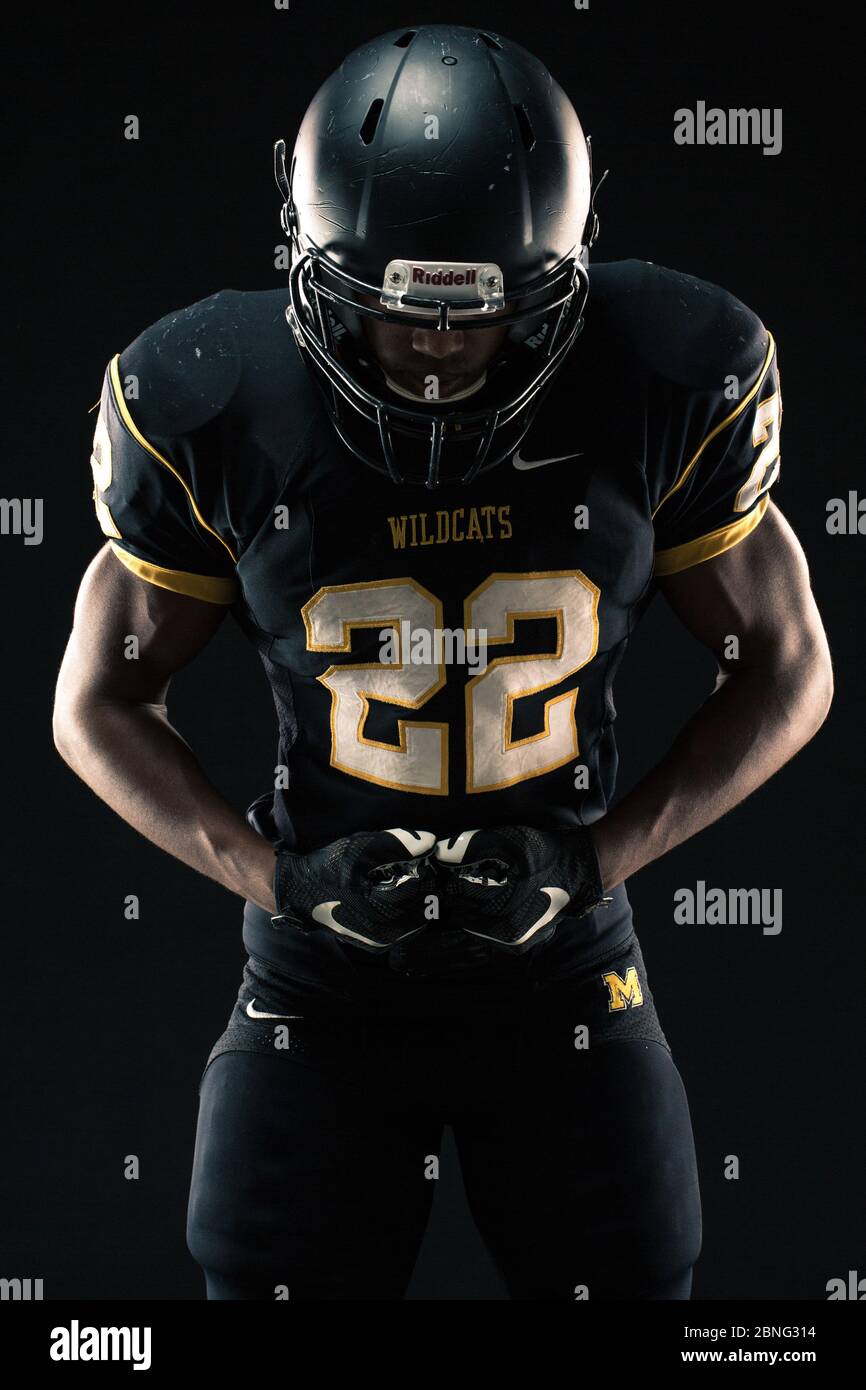 African American football player isolated on black Stock Photo - Alamy