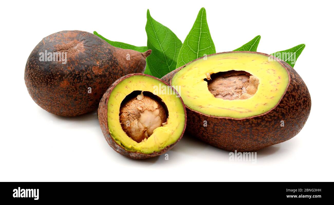 Fresh Avocados two whole and one halved isolated on white Stock Photo ...