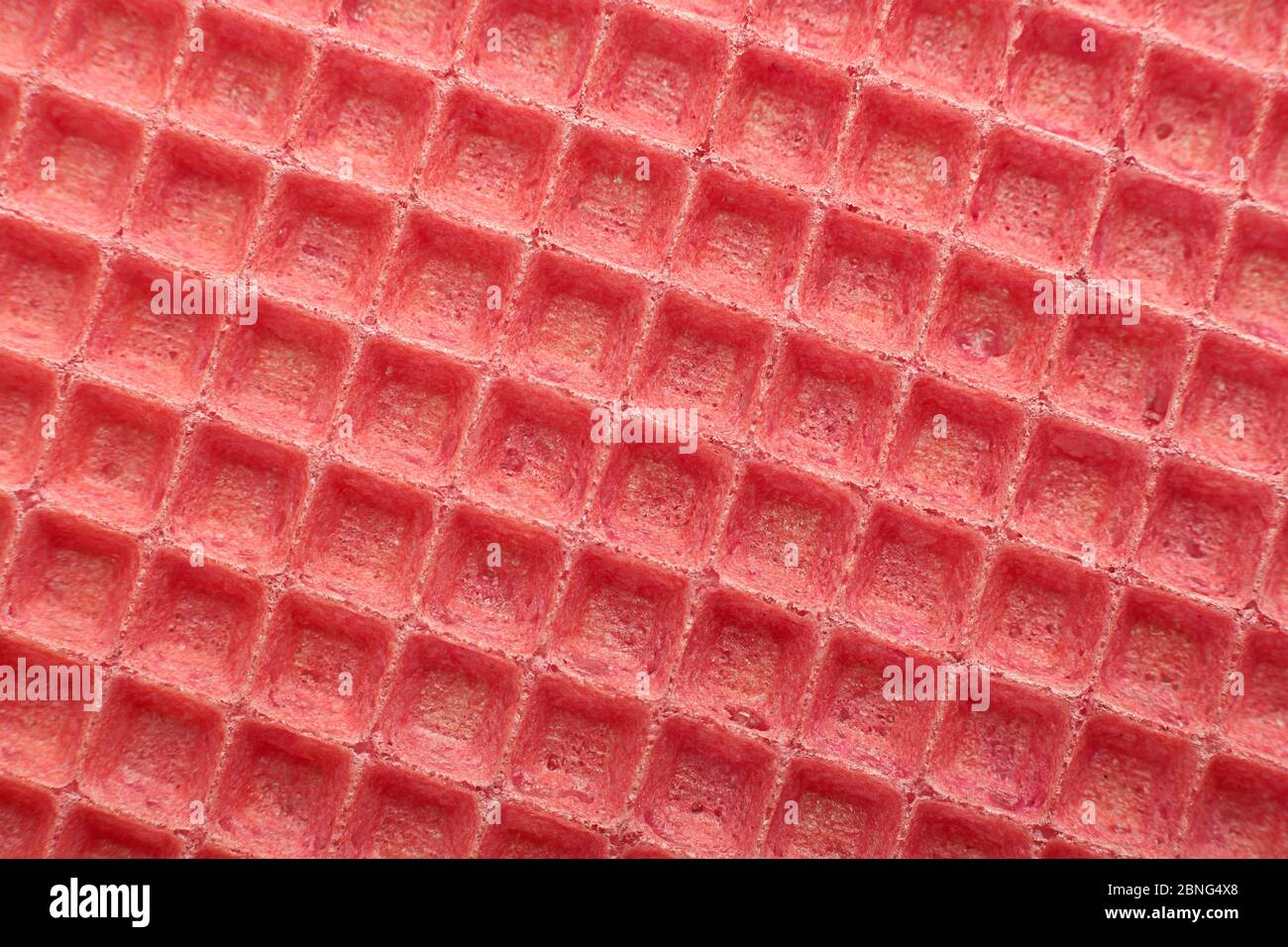 Red waffles surface closeup detail background Stock Photo - Alamy