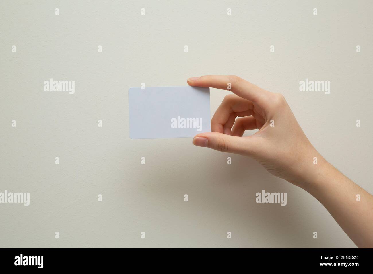 hand holding white card Stock Photo - Alamy