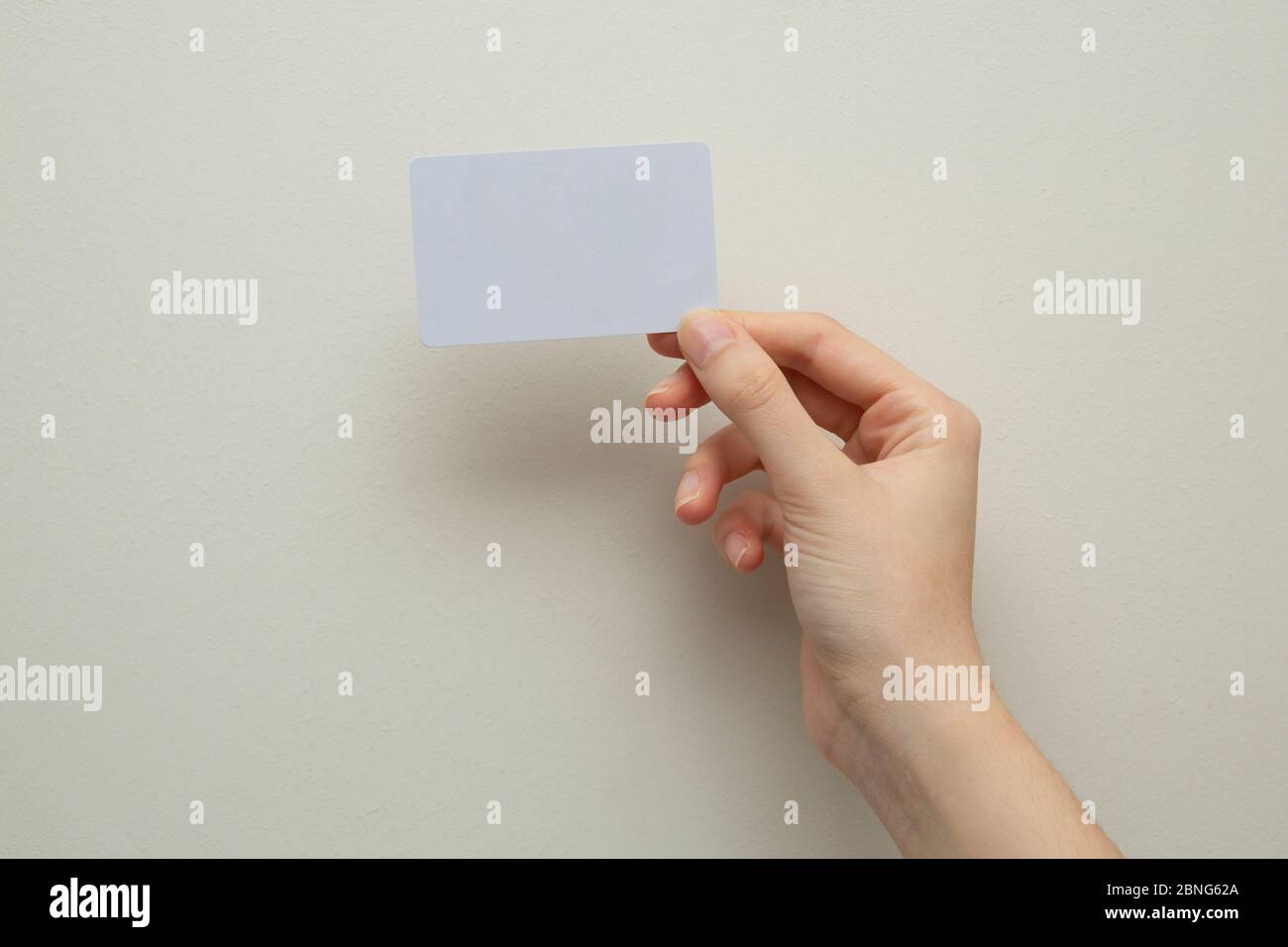 hand holding white card Stock Photo - Alamy