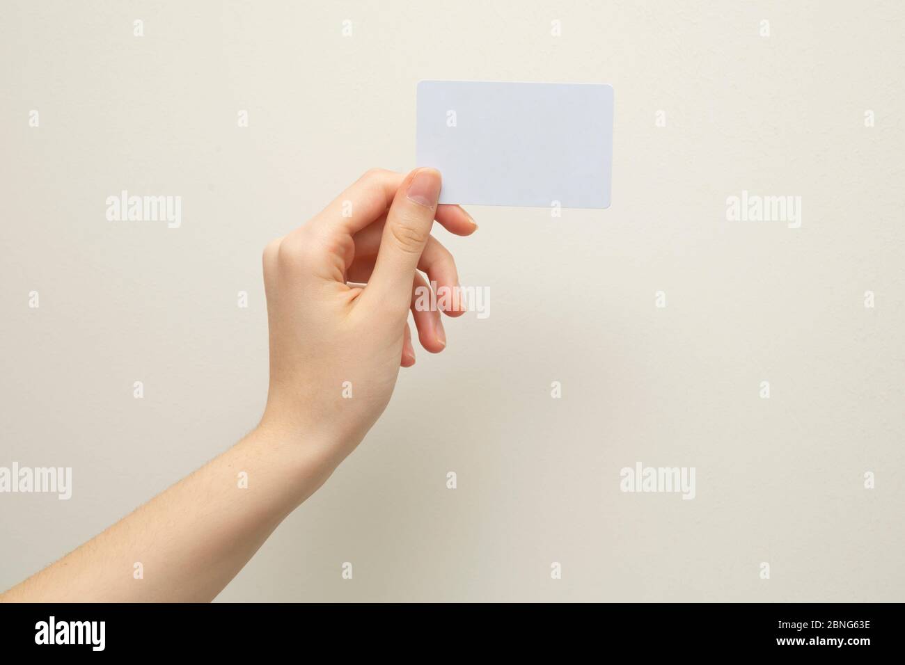 hand holding white card Stock Photo - Alamy
