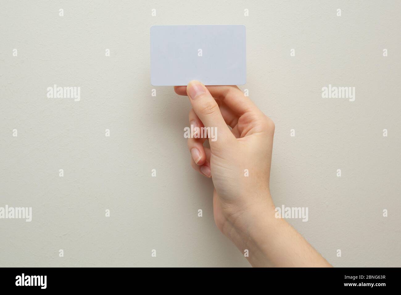 hand holding white card Stock Photo - Alamy