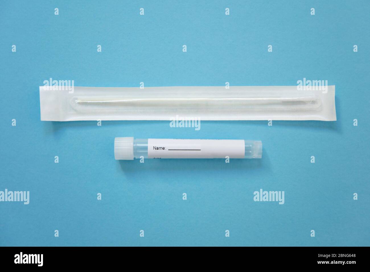 Virus testing swab and test tube on a blue background Stock Photo - Alamy