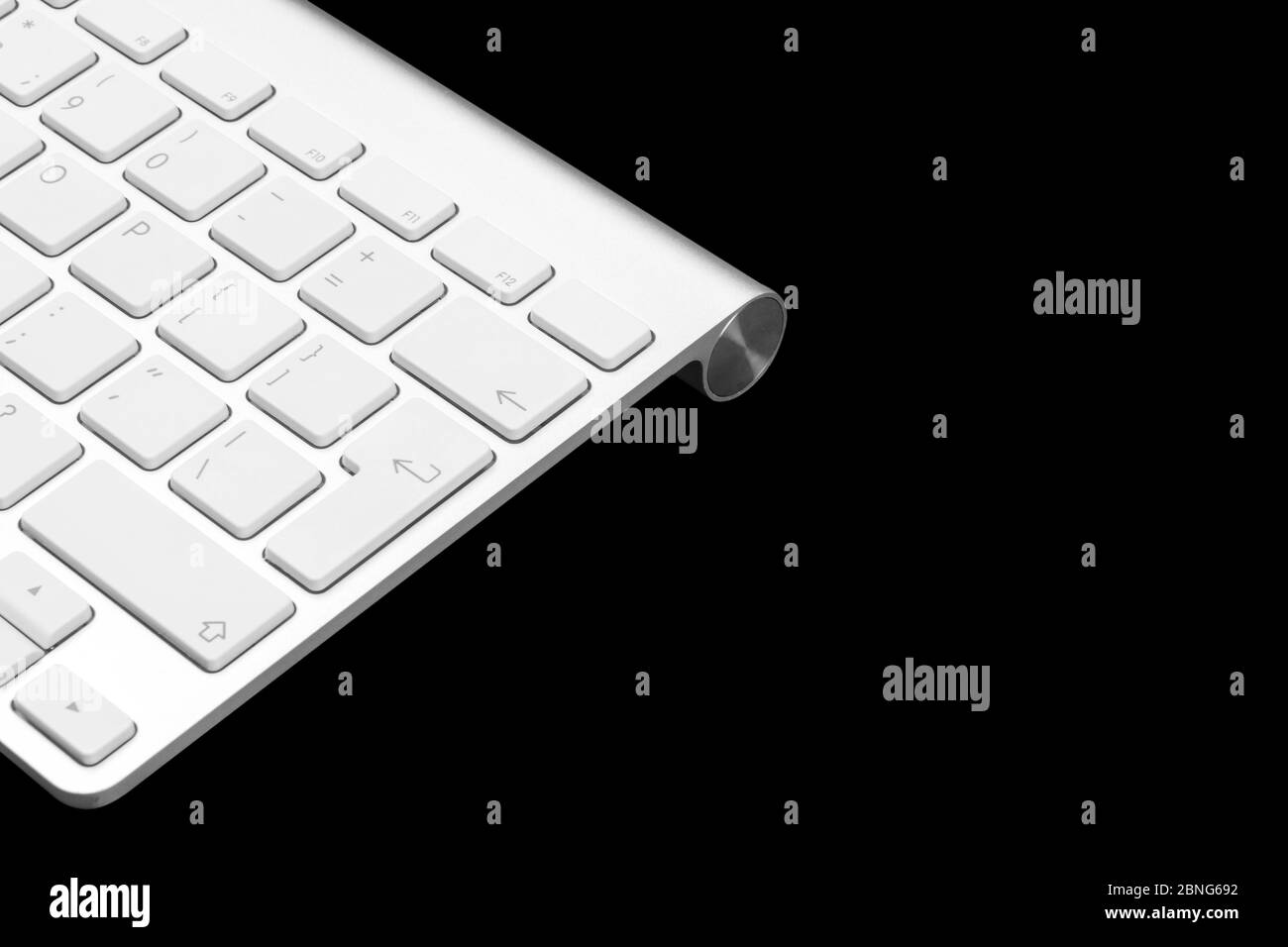 Closeup of a modern computer keyboard isolated on black background ...