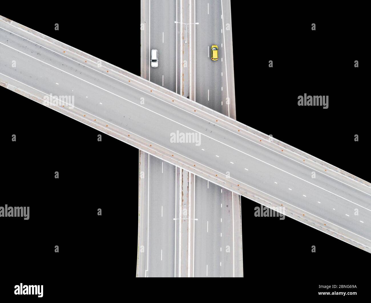 Aerial view of highway in city isolated on black background. Cars crossing interchange overpass ...