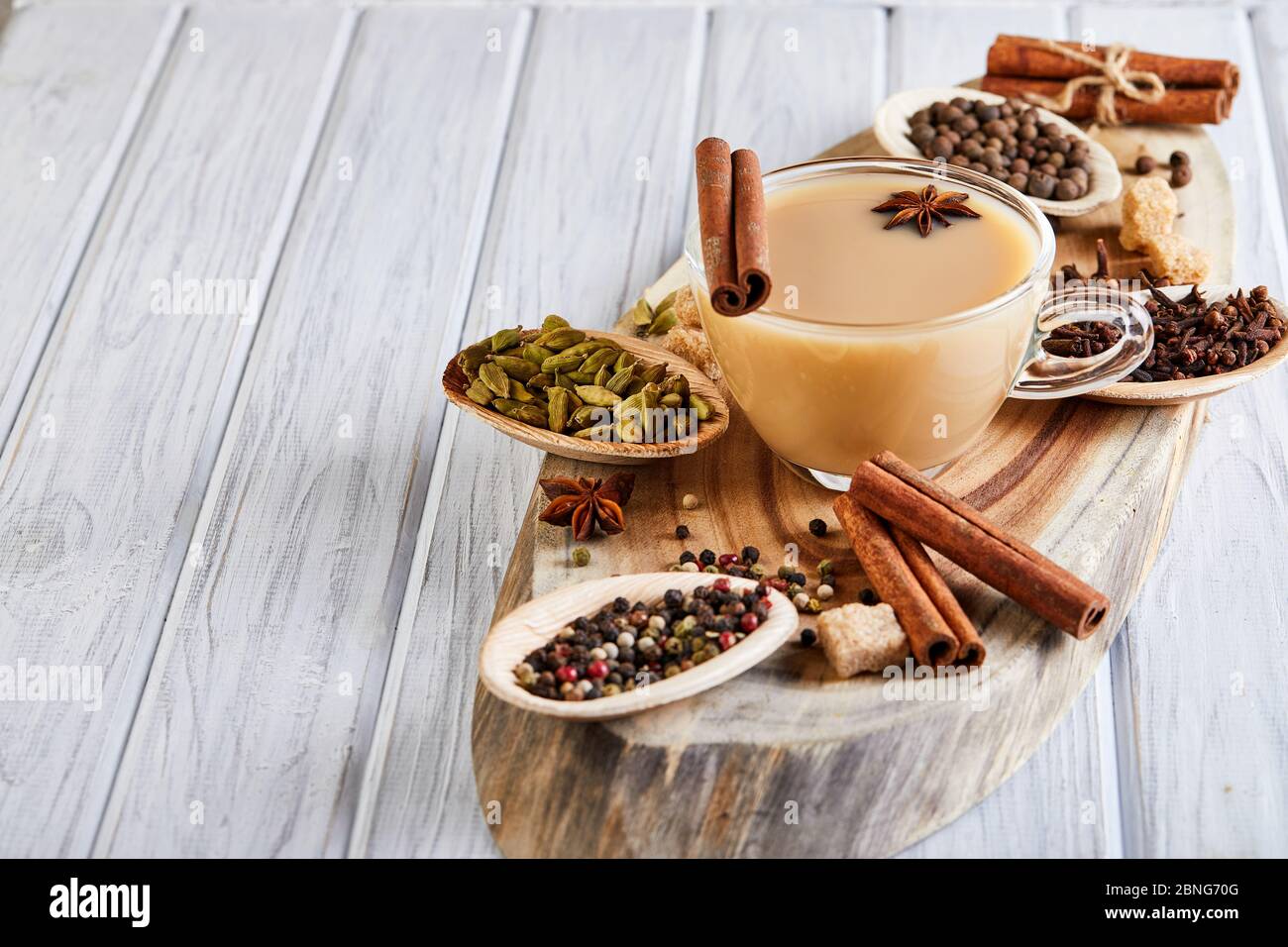 Traditional Indian drink - masala tea with spices. Cinnamon, cardamom ...