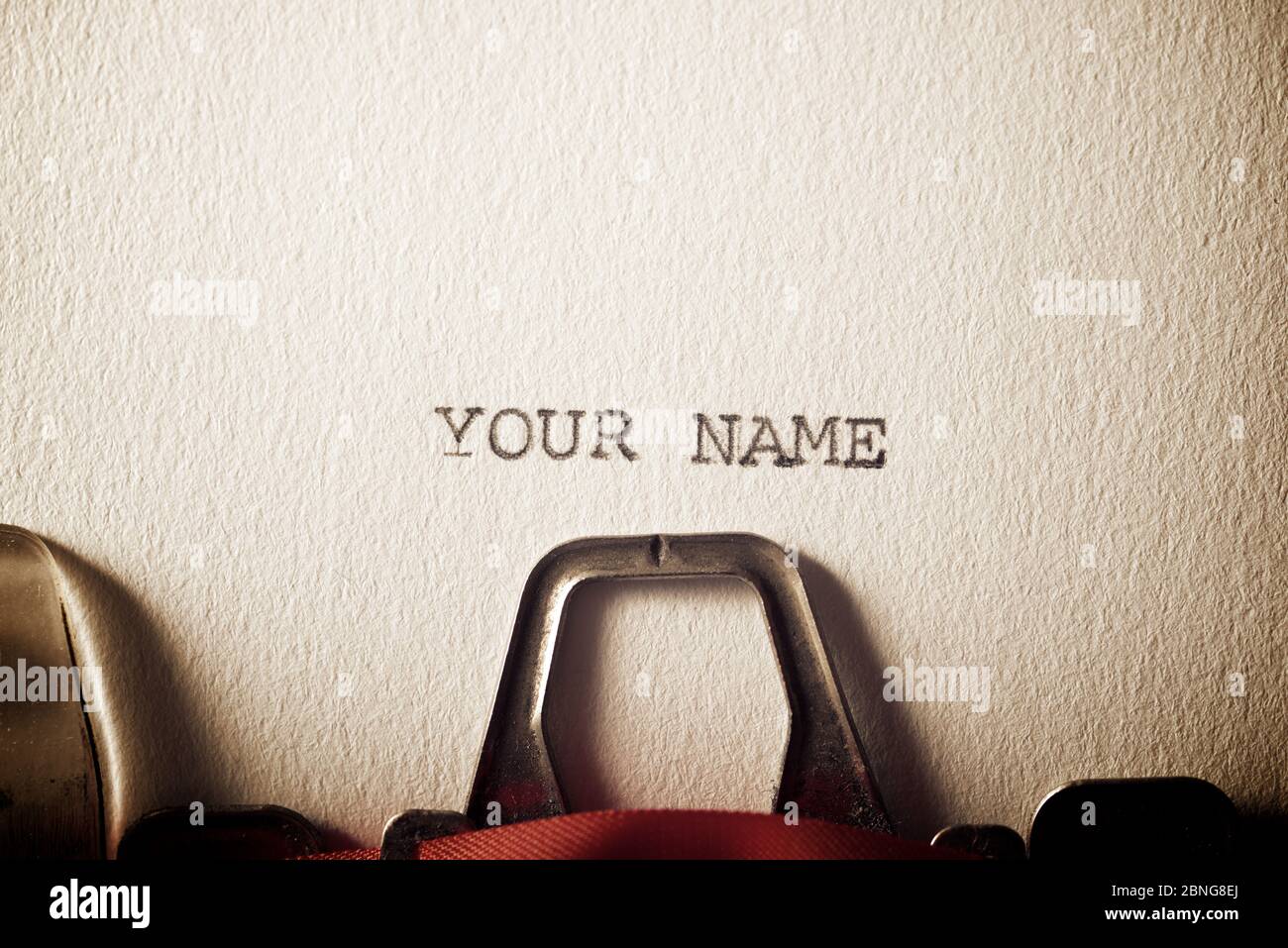 The sentence, your name, written with a typewriter Stock Photo - Alamy
