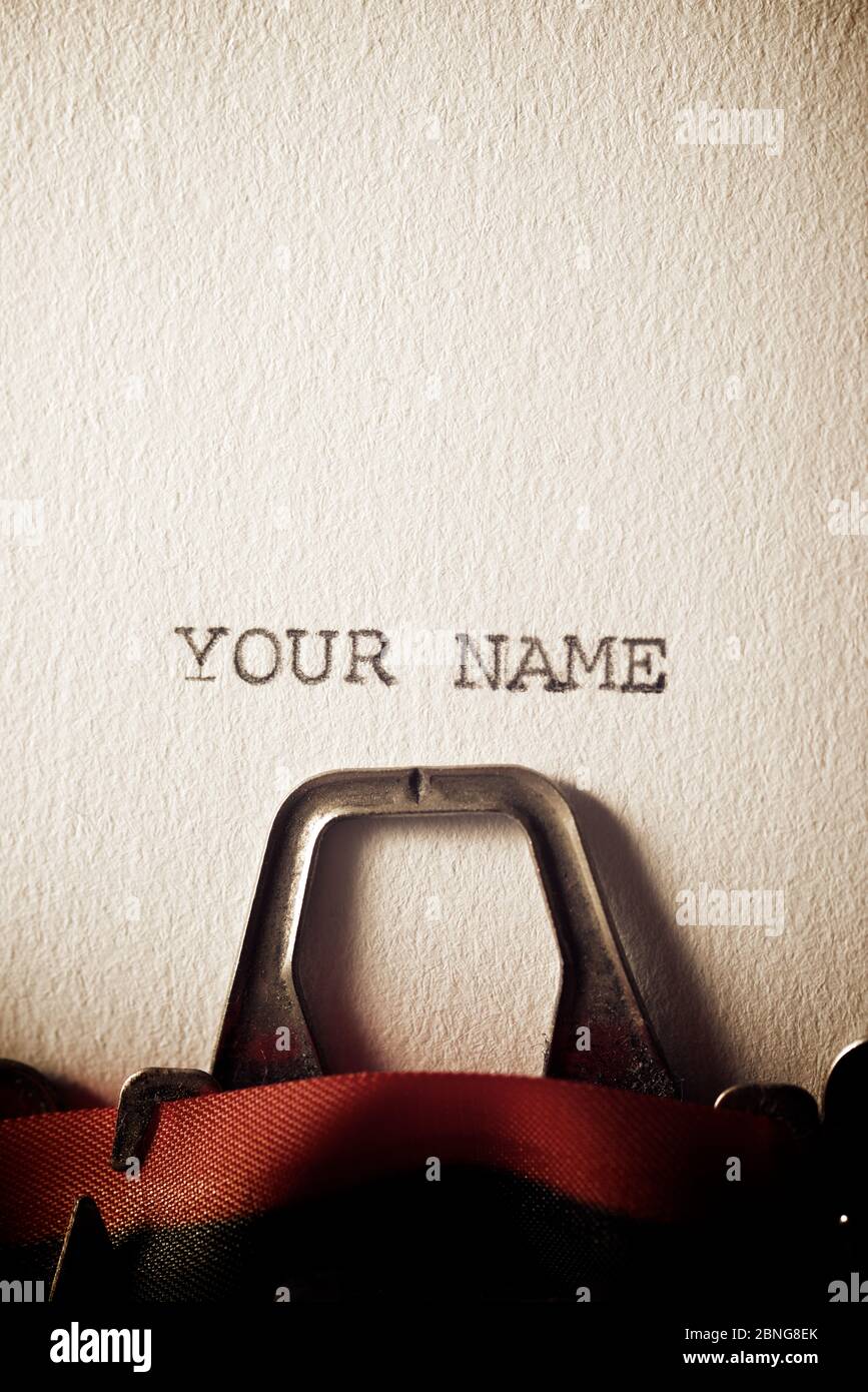 The sentence, your name, written with a typewriter Stock Photo - Alamy