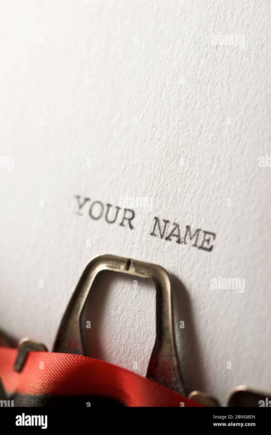 The sentence, your name, written with a typewriter Stock Photo - Alamy