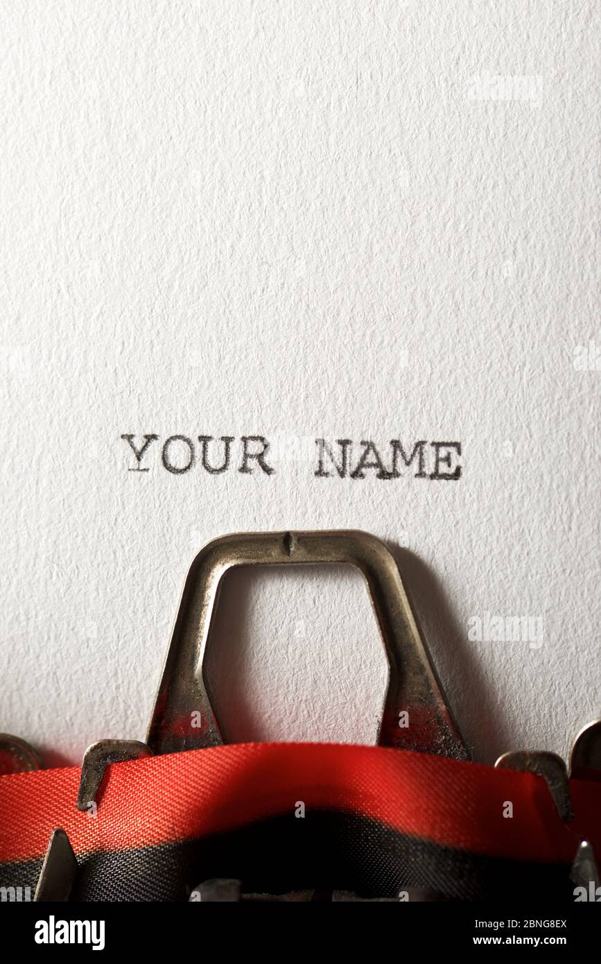 The sentence, your name, written with a typewriter Stock Photo - Alamy