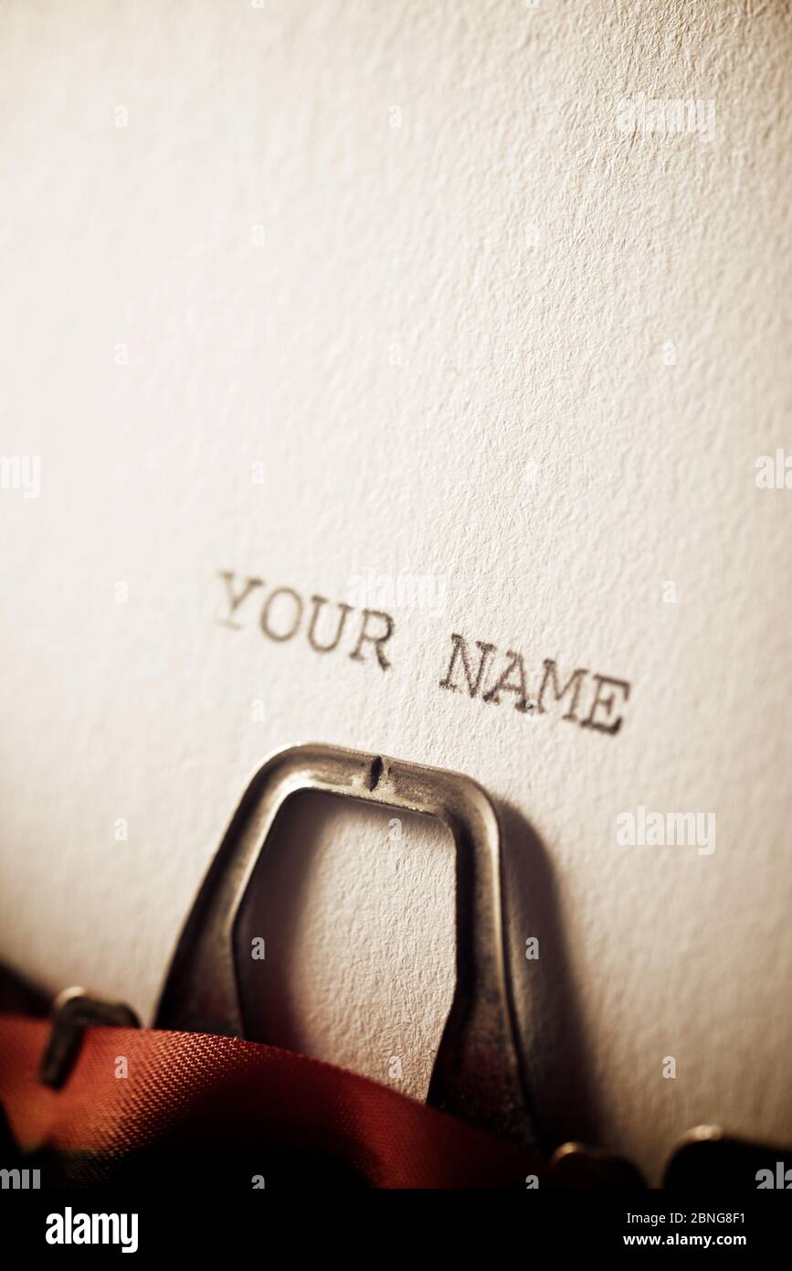 The sentence, your name, written with a typewriter Stock Photo - Alamy