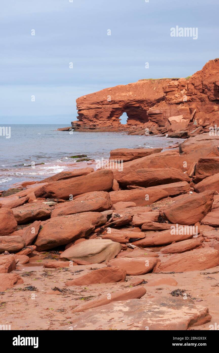 Natural arch among sandstone cliffs. Coastal erosion on Prince Edward ...