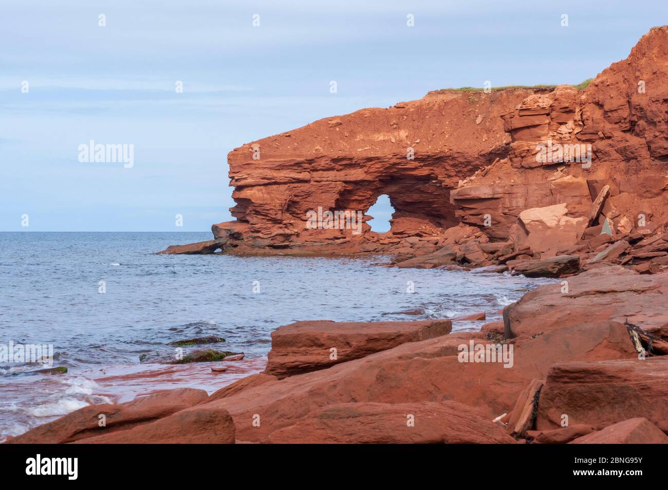 Natural arch among sandstone cliffs. Coastal erosion on Prince Edward ...