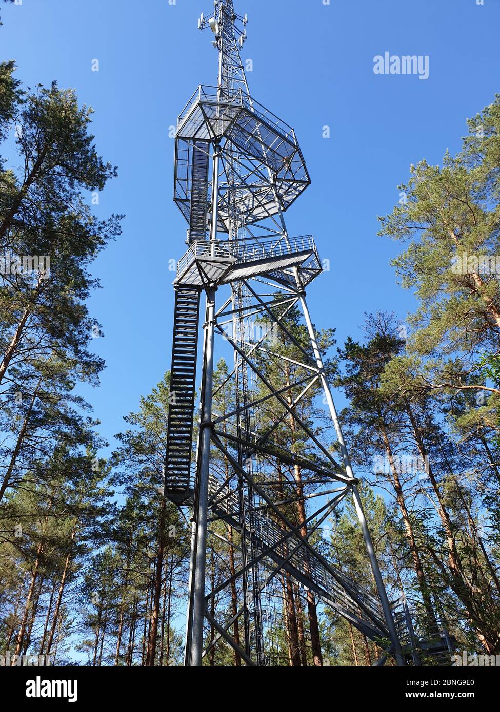 Review and telecommunications tower in the forest Stock Photo - Alamy