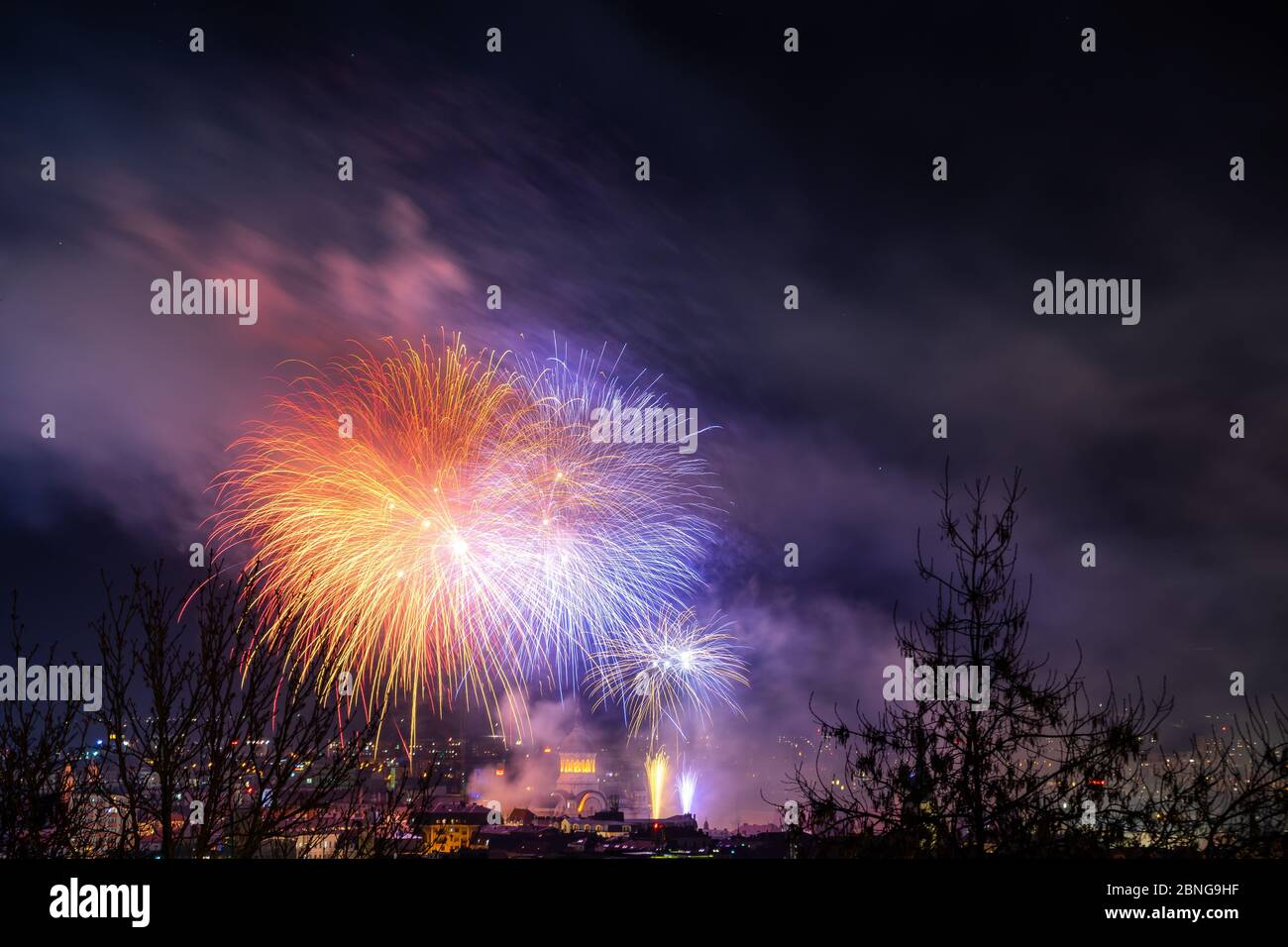 Beautiful view of colorful fireworks over the city in the night sky ...
