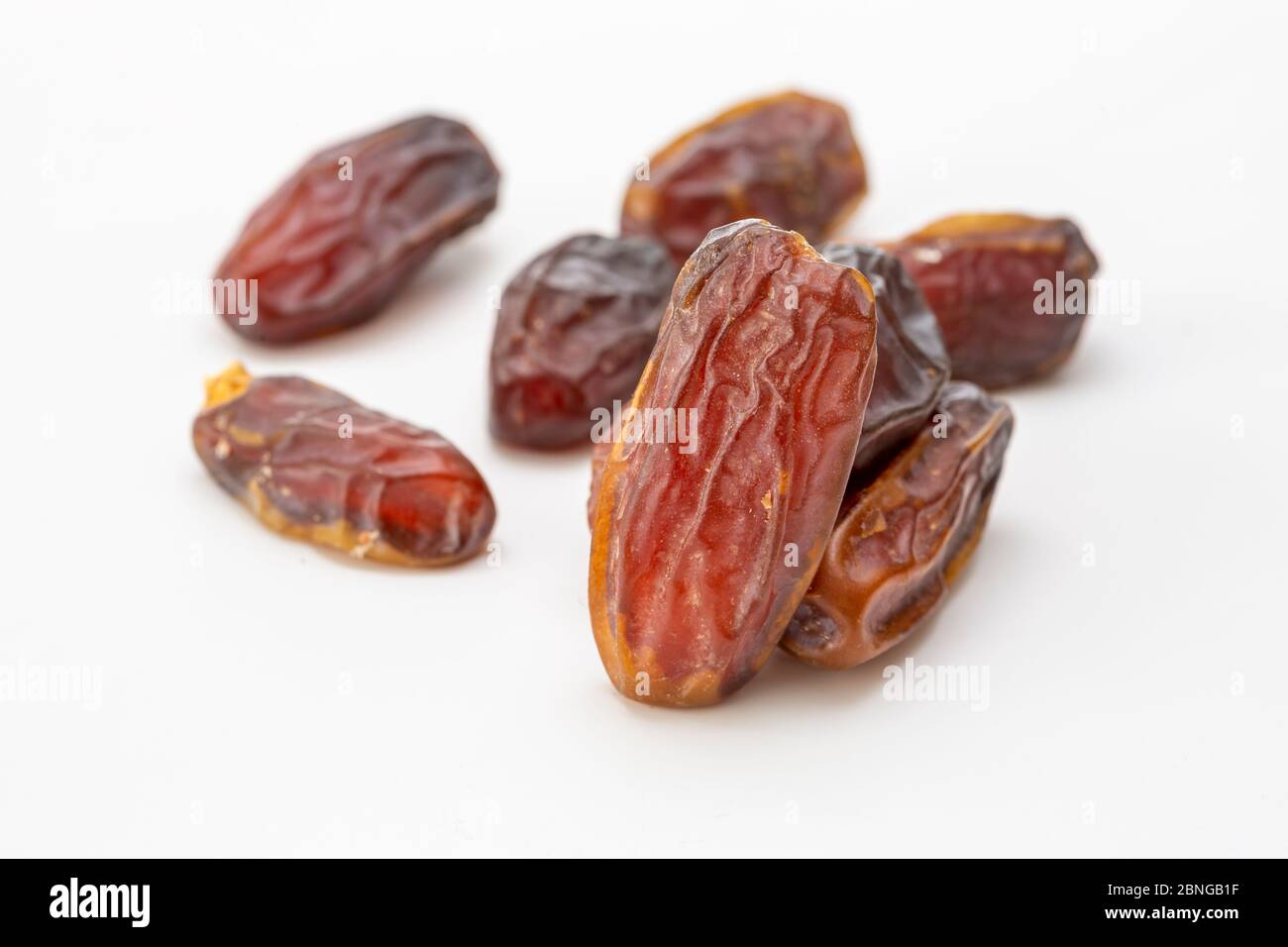 pitted dates isolated on white background Stock Photo - Alamy