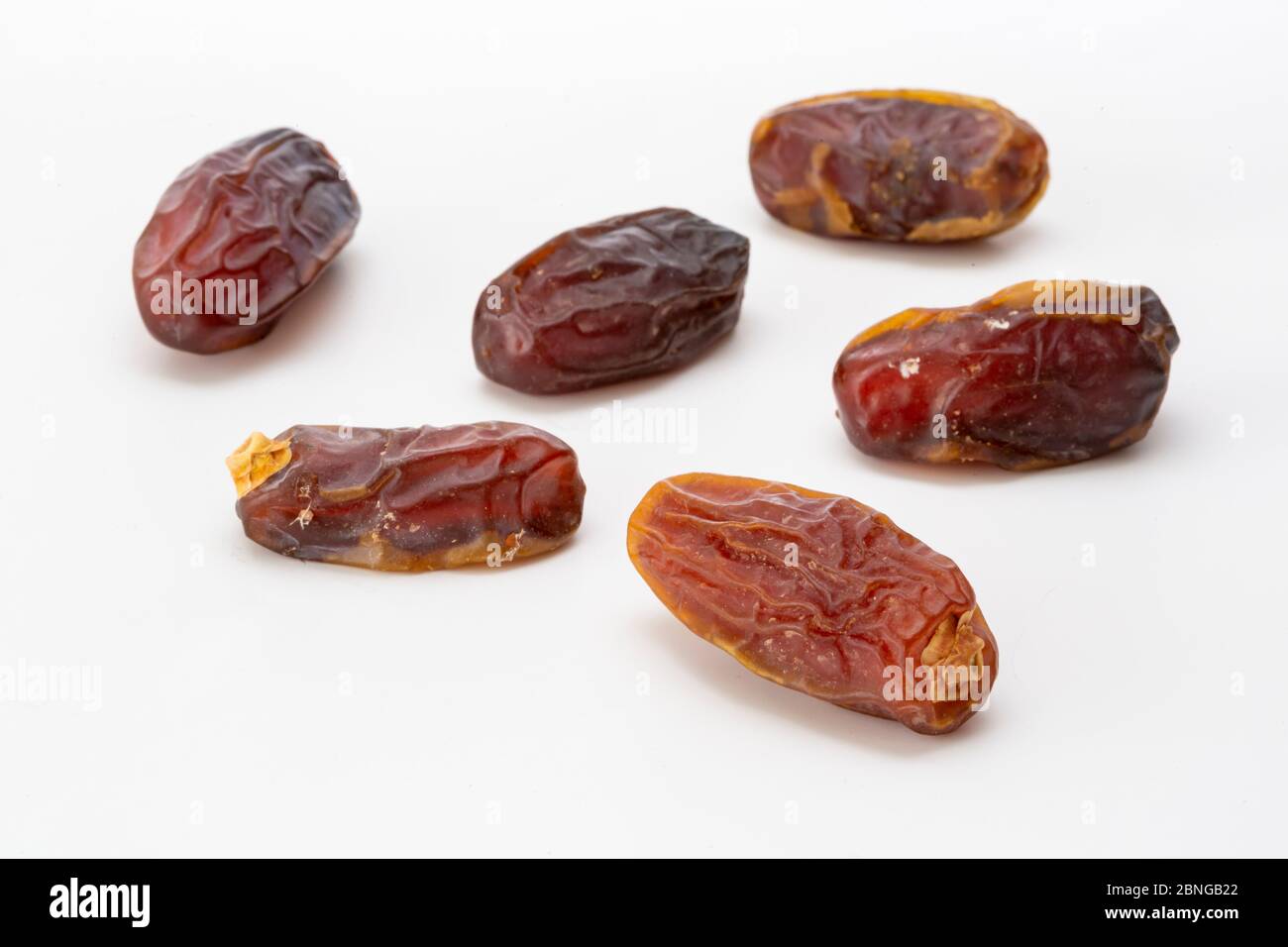 pitted dates isolated on white background Stock Photo - Alamy