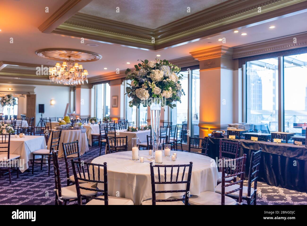 Beautiful wedding hall with tables with elegant setting Stock Photo - Alamy