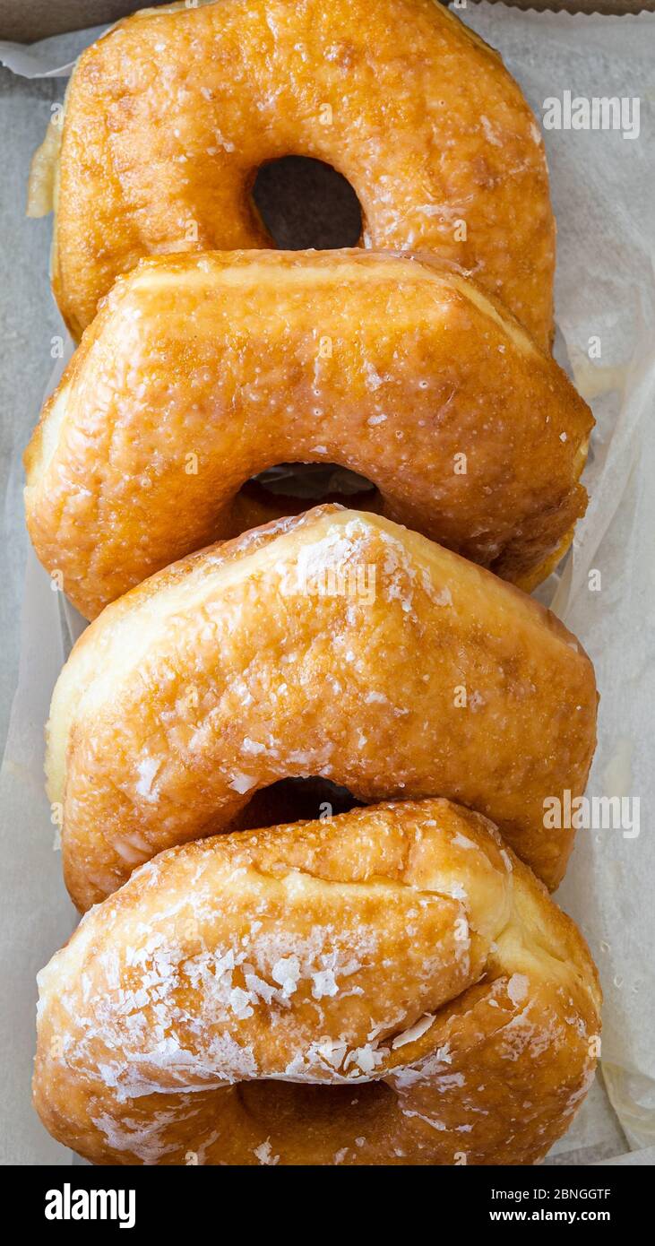 Top view of a row of freshly baked doughnuts Stock Photo - Alamy