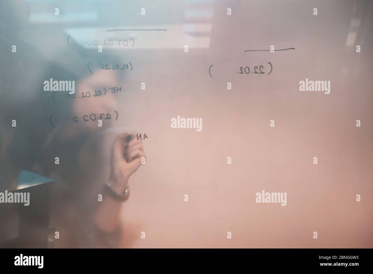 Business woman writing on glass Stock Photo - Alamy
