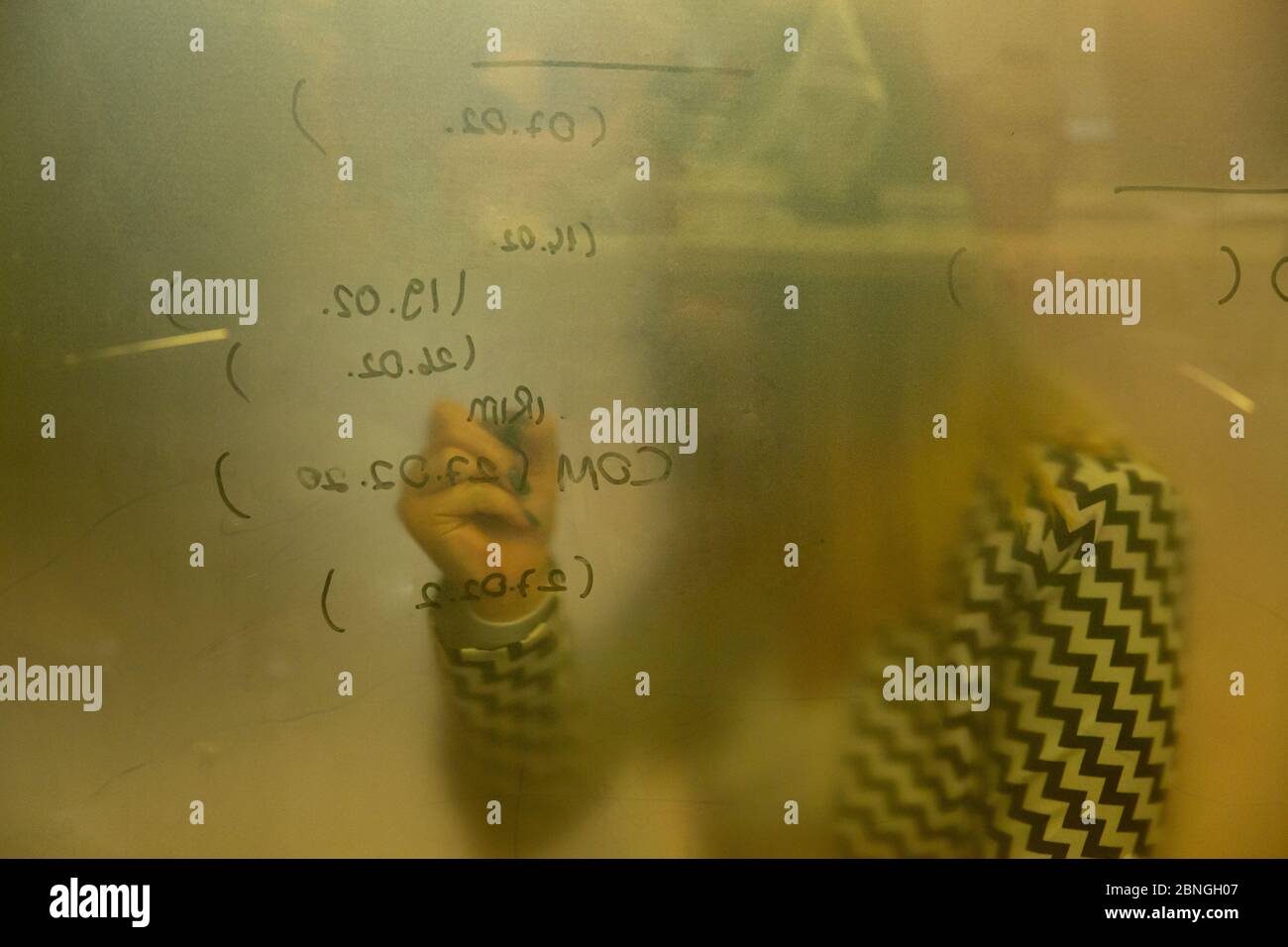 Business woman writing on glass Stock Photo - Alamy
