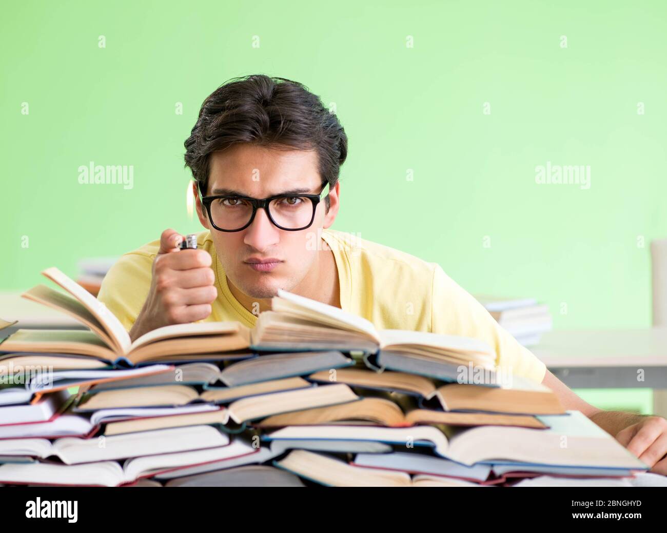 The student with too many books to read before exam Stock Photo - Alamy