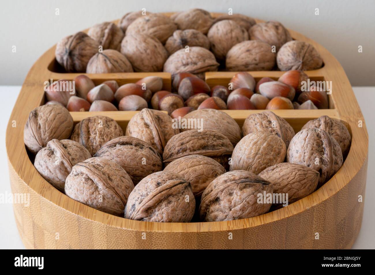 Bamboo bowl with walnuts Stock Photo - Alamy