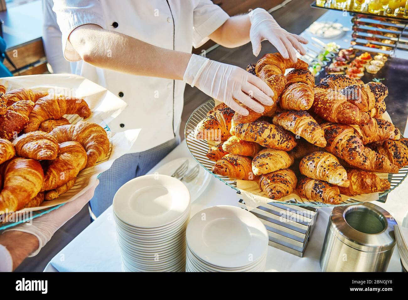 Hands with croissants gloves hi-res stock photography and images - Alamy