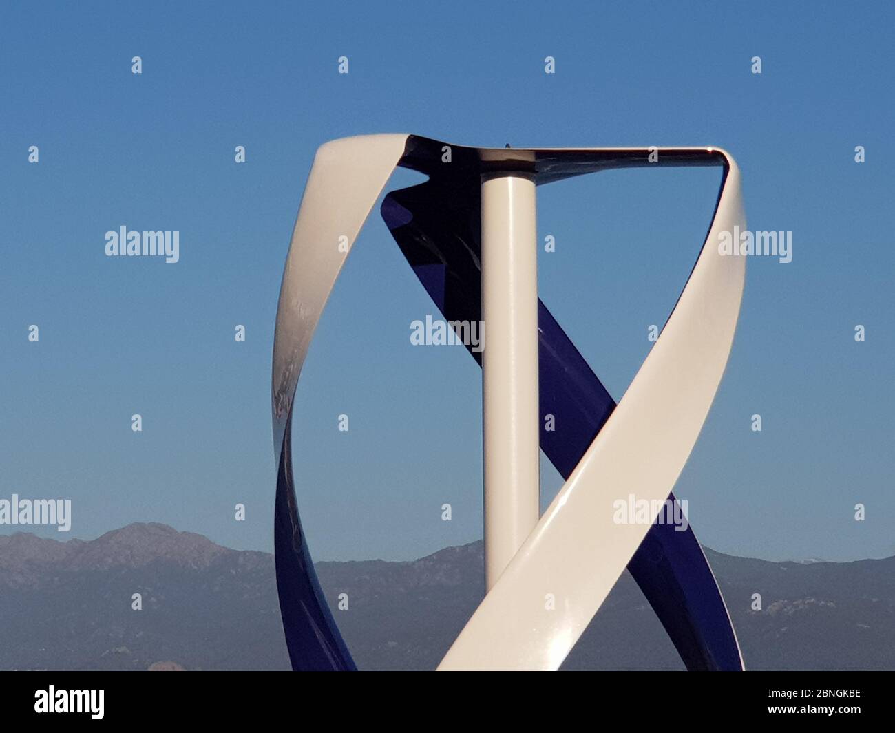 Closeup of a helical wind turbine against a clear blue sky in Corsica ...
