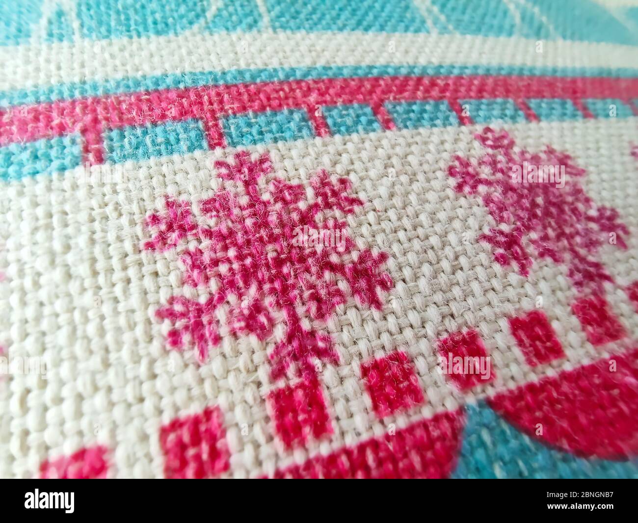 Closeup shot of white and blue thread fabric with red snowflakes Stock ...