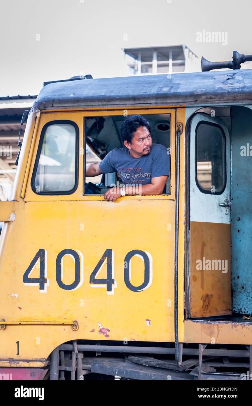 A train driver waits for the all clear on a platform at Hua Lamphong ...