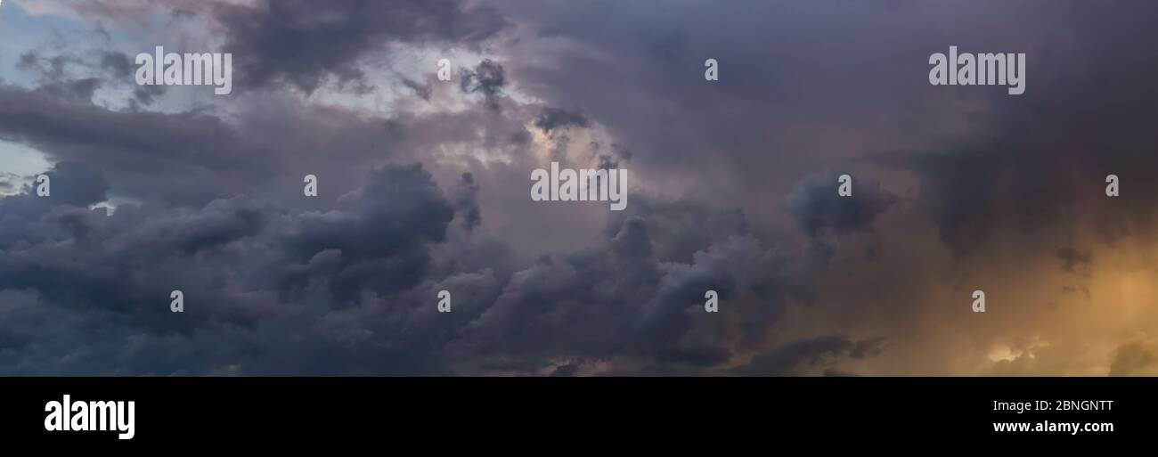 Amazing panoramic storm rainy cloud with blue sky and orange sun Stock ...