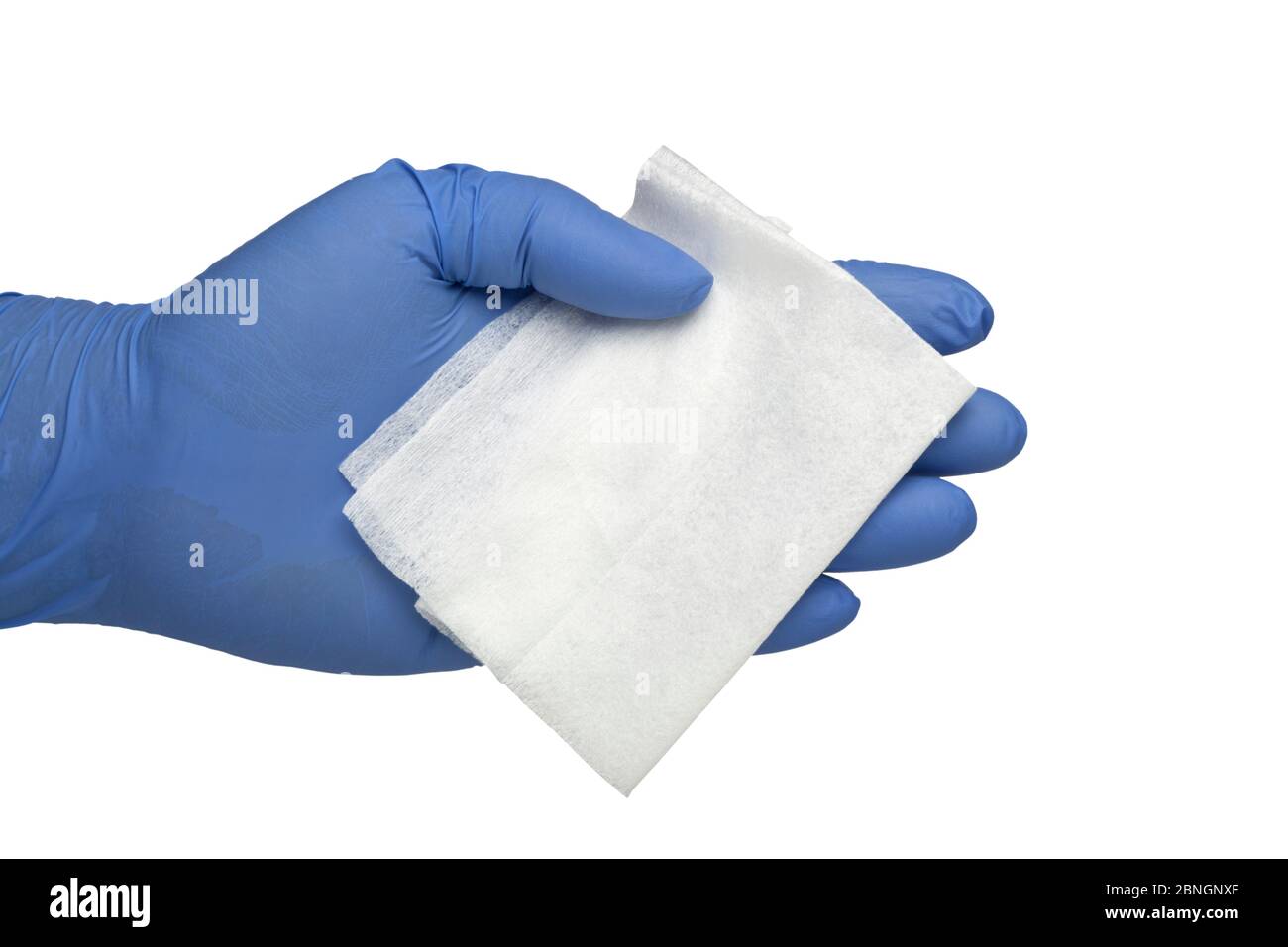 Gloved hand holding a piece of antibacterial cleansing wipe isolated on ...