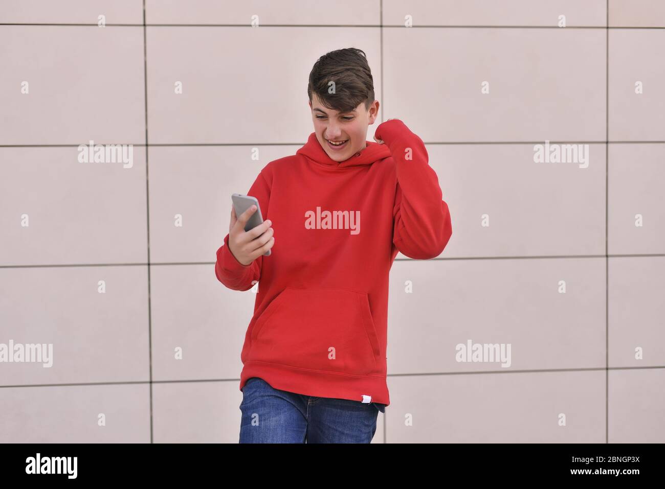 portrait of smiley teenager. dressing in a red shirt Stock Photo - Alamy