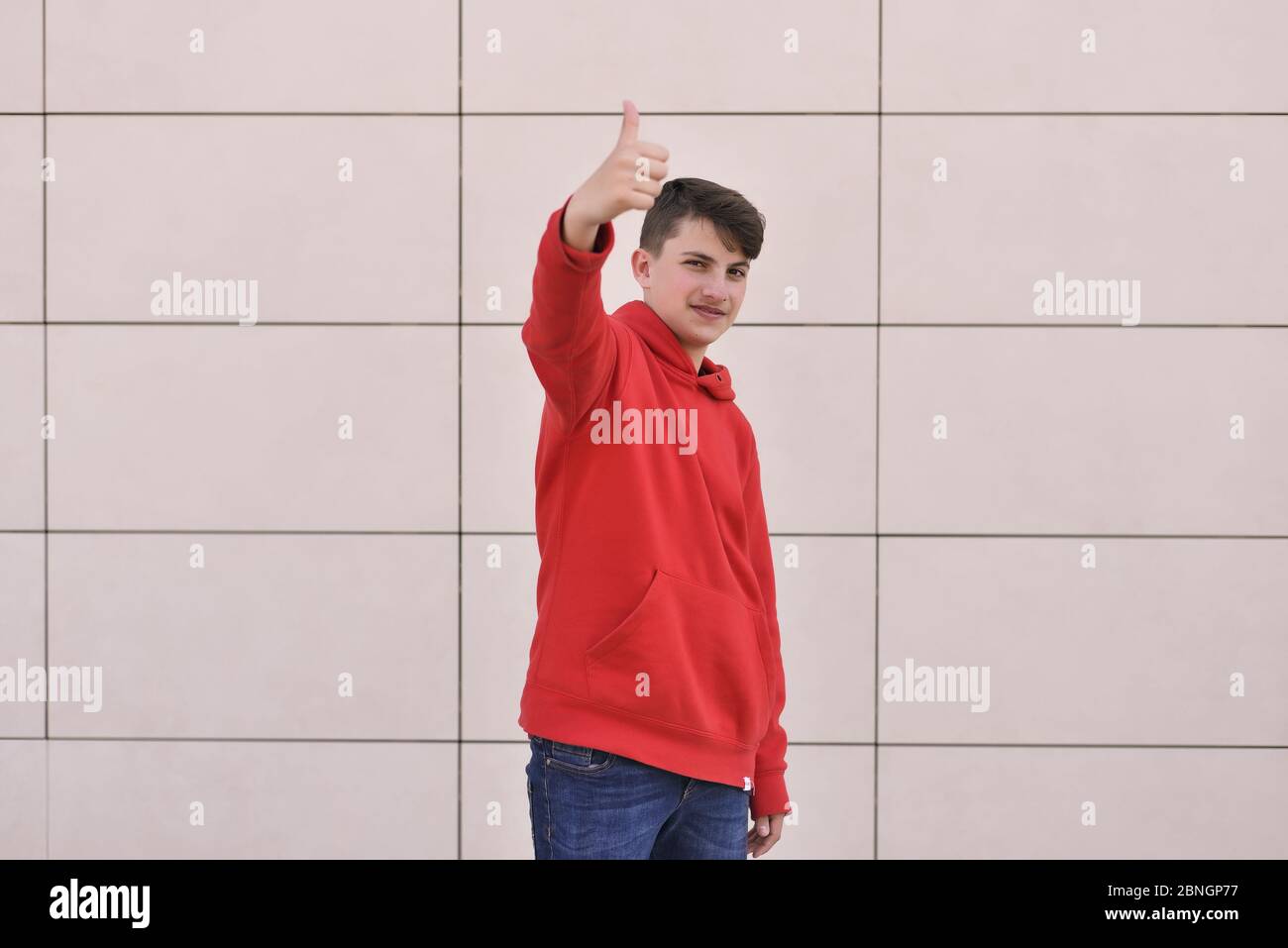 portrait of smiley teenager. dressing in a red shirt Stock Photo - Alamy