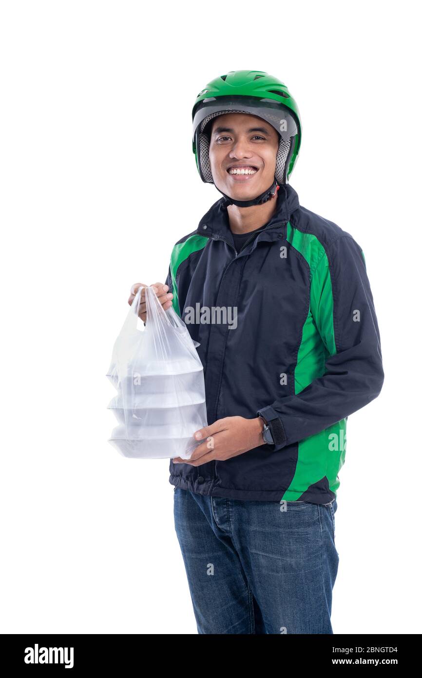 fast food delivery. man with uniform jacket and helmet delivering food ...