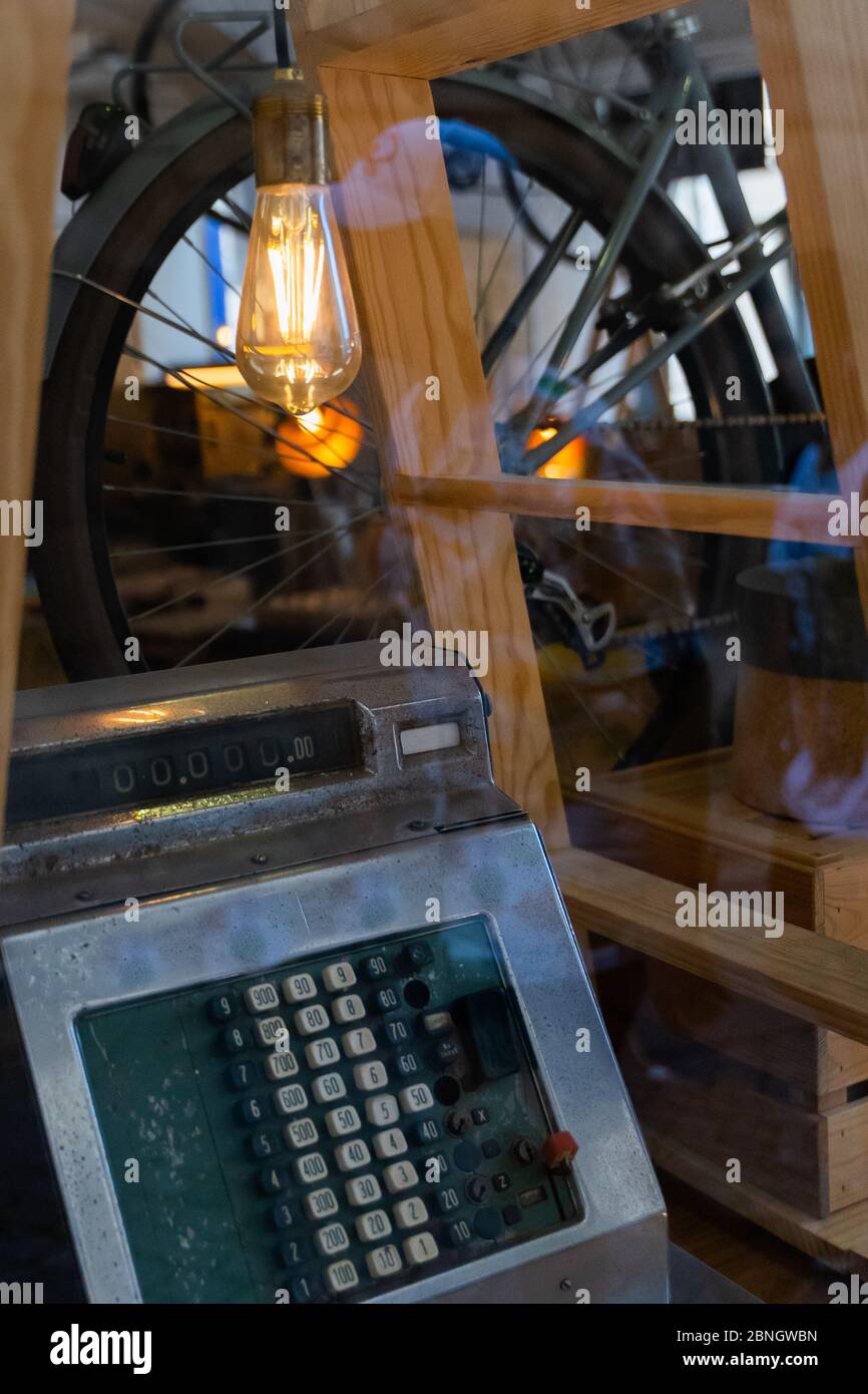 decorative edison style light bulb against wooden stairs and bicycle ...
