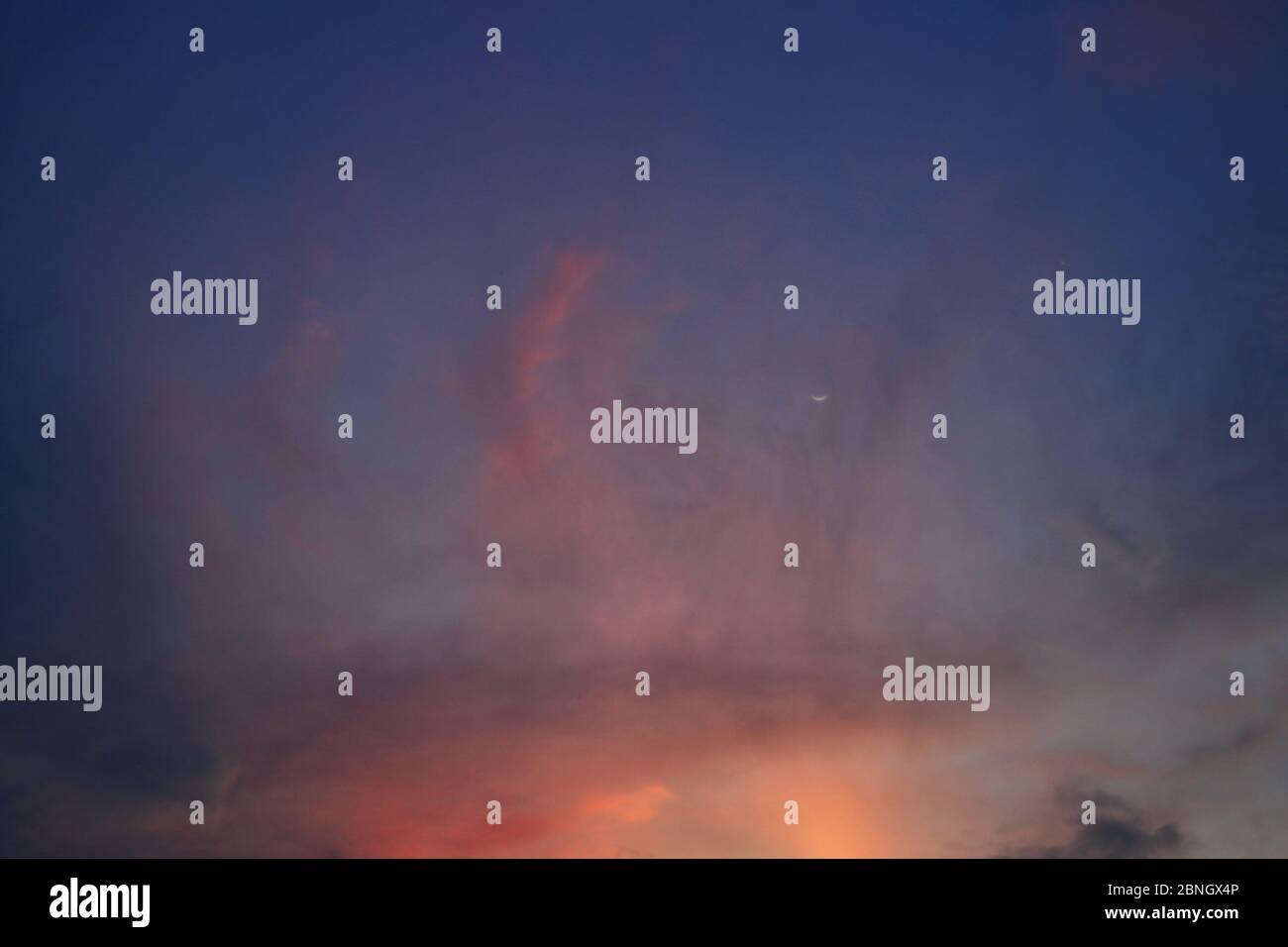 clearing of the last cloud. small clouds blown away by wind at sunset ...